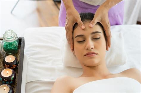 Premium Photo Cropped Hands Of Massage Therapist Massaging Young