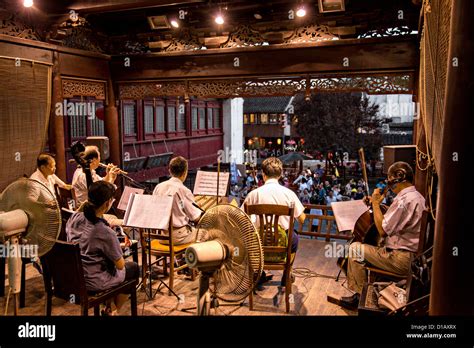 Traditional Chinese Musicians Play From The Ancient Opera Stage At