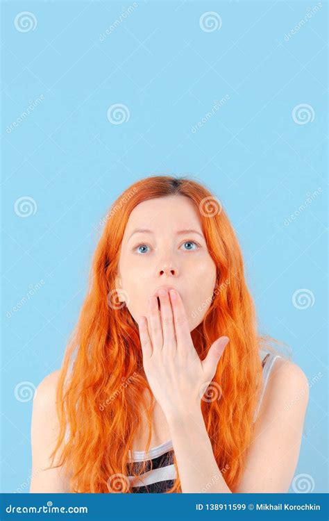 Redhead Girl Covers Her Mouth With Her Hand Surprise And Shock Stock