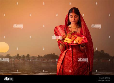 Woman From Bihar Offers Prayers To The Sun In The Early Morning Hours