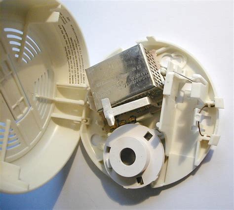 Free Image Of Smoke Detector With Open Casing On White Ceiling