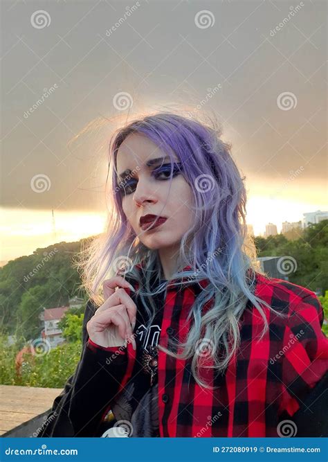 Beautiful Anime Girl Cosplayer With Purple Hair Rock Music Fan Stock