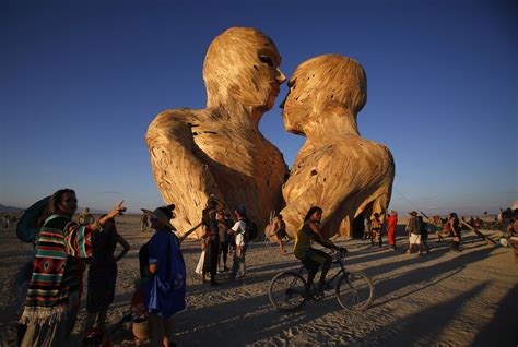 People Gather Around The Art Installation Embrace During The Burning