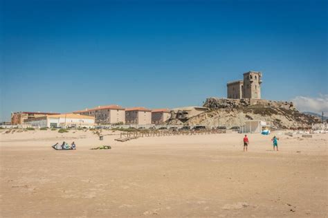 Premium Photo People At Beach Against Clear Blue Sky