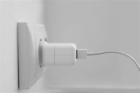 Premium Photo Charging Adapter Plugged In Electric Socket Closeup
