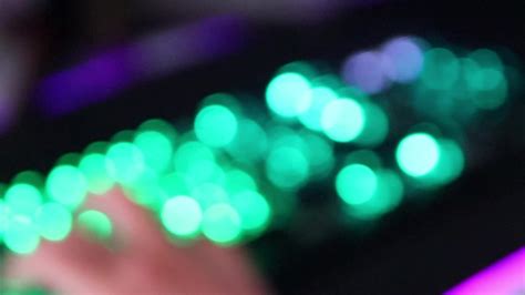 Teenager Playing Computer Games At Illuminated Desktop Pc As Blurry Background Showing Esports