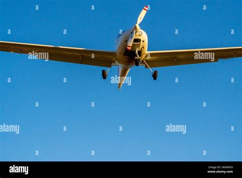 Single Propeller Plane Landing From A Nose Down View Centred In The