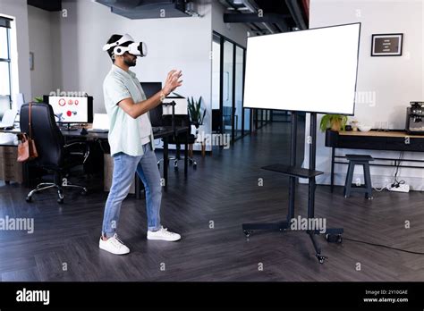 Using Vr Headset Indian Man Interacting With Virtual Display In Modern Office Copy Space Stock