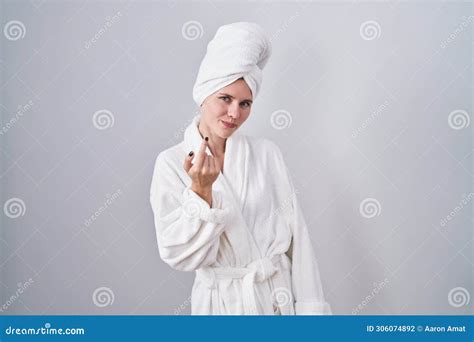 Blonde Caucasian Woman Wearing Bathrobe Beckoning Come Here Gesture