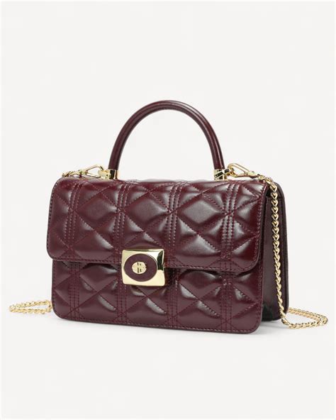 ساغا شنطة كتف قفل مغناطيسي بحزام لون عنابي شنط ساغا