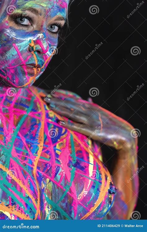 Naked Female Is Being Painted With Colorful Paint In A Home Environment