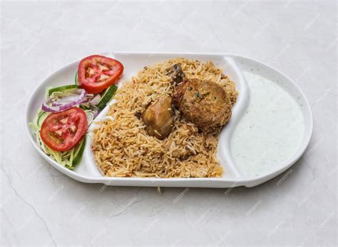 Premium Photo Spicy Chicken Pulao Or Biryani With Raita And Salad
