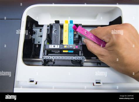 Technicians Are Install Setup The Ink Cartridge Of A Inkjet Printer The Device Of Office