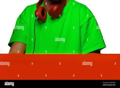 Stylish Fashionable Dj With Red Headphones Around His Neck In A Light