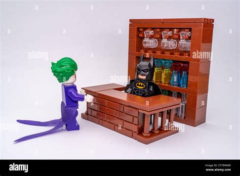 A Bar Scene With Lego Mini Figures Of Batman And Joker On A White