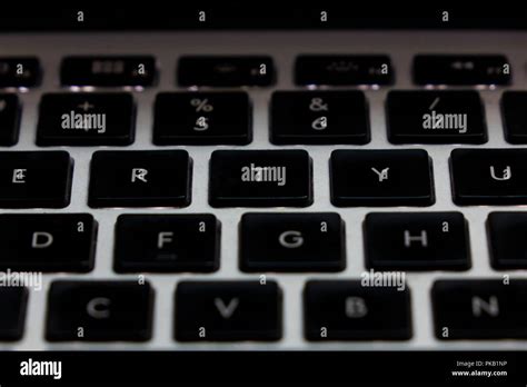 Detail Illuminating The Keyboard With A Focus On Capslock Stock Photo