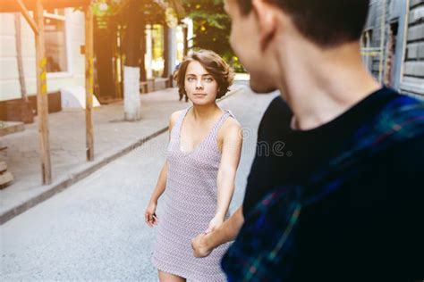Couple Walking On The Street Holding Hands Stock Image Image Of
