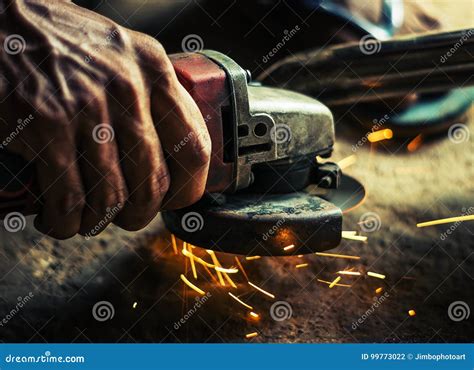 Hand Of Man With Steel Cutter Tool Blurred On Black Background Stock