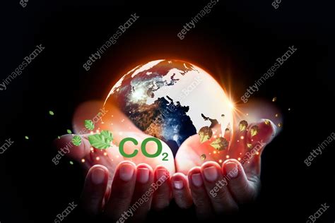 Hand Hold Earth Energy At Night On Tablet Depicting The Issue And