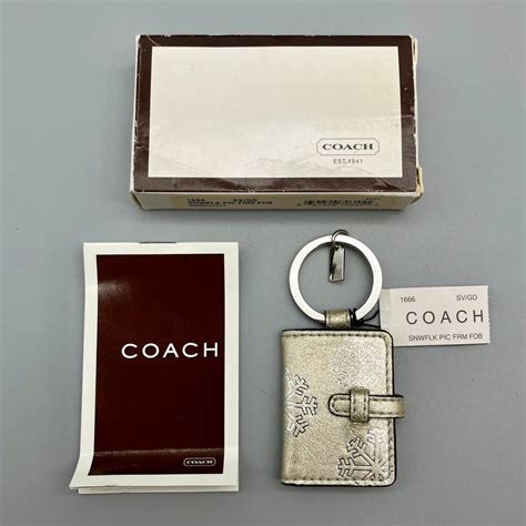 【未使用】【未使用】コーチ Coach 手帳型 フォトケースフレーム 写真入れ スノーフレーク 雪の結晶 キーホルダーリング バッグ