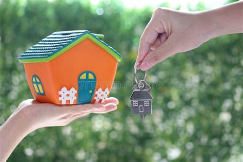 Purchase House Woman Holding Model House And Real Estate Agent Giving