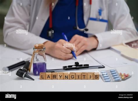 An Experienced Doctor Analyzes Laryngitis Symptoms With Diagnostic Tools And Notes For Effective