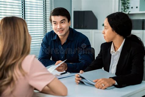 Young Female Asian Candidate Tries To Impress Interviewer By Being