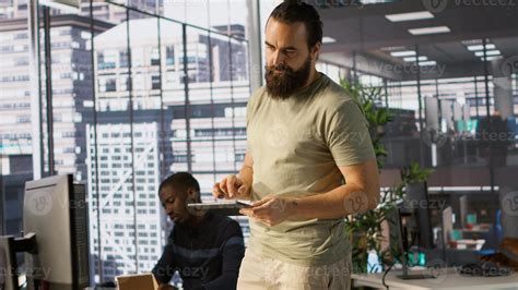 System Administrator Checking Results On Tablet After Creating Complex