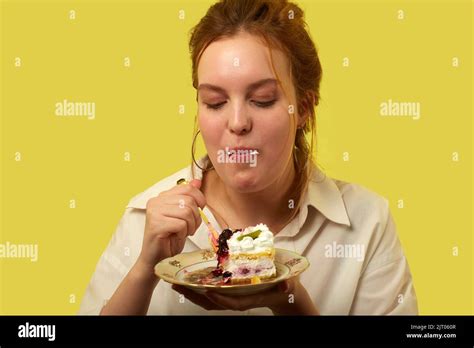 Fun Pretty Red Hair Girl With Sweet Dessert On Yellow Background Stock