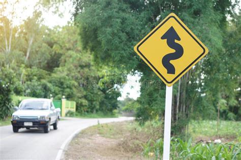 Yellow Traffic Sign With Arrow Left Curve Symbol Stock Photo Image Of