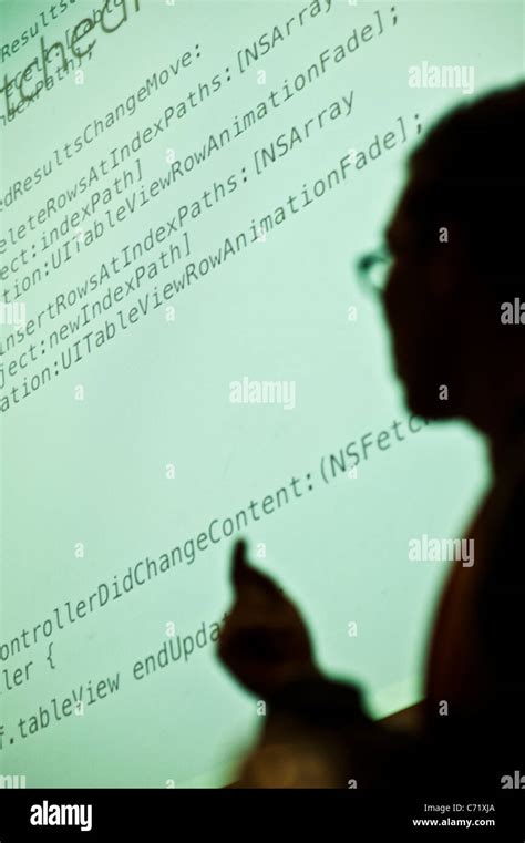 A Man Presenting A Page Of Computer Code At Iosdev Uk App Developer