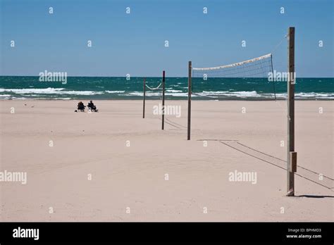 Volleyball Nets On Ludington Lake Michigan Beach And Two Lonely Women