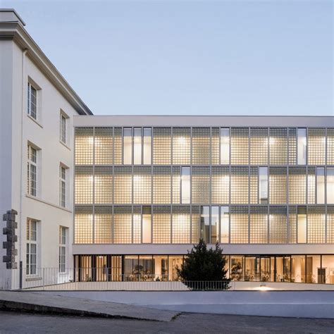 Glass Brick Facade Pulls Light Into Belgian Infill Home