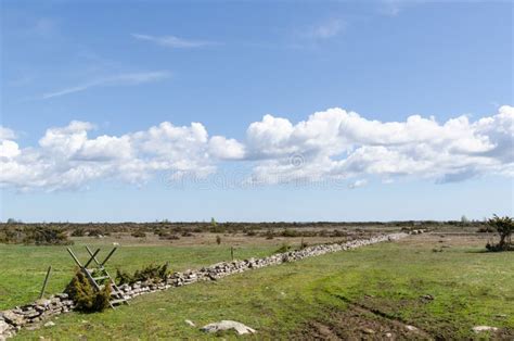 Wooden Stile By A Dry Stone Wall In The Great Plain Grassland Alvaret