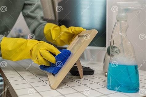 The Wife Is Cleaning Her Husband Home Office Cleanup The Room Wearing