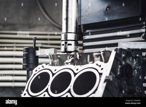 Car Engine Cylinder Head On CNC Machine During Service Boring Piston