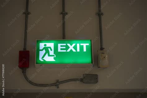 Exit Sign Banner With Lighting On The Wall Over Walkway In Building Stock Photo Adobe Stock