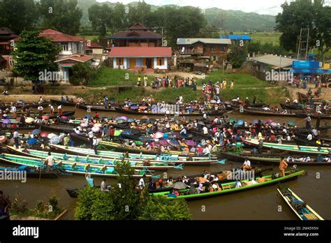 Peoples Paddle By Legs On The Procession In Phaung Daw Oo Festival