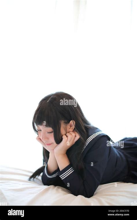 Portrait Japanese School Girl Sleeping In White Tone Bed Room Stock