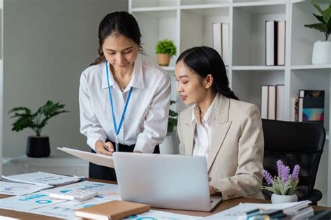 Professional Business Meeting In Modern Office With Diverse Team Collaborating On Project