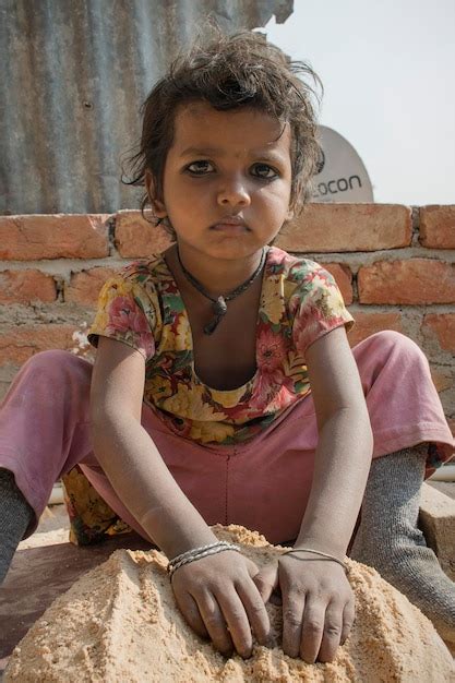 Premium Photo Portrait Of Girl Playing In Mud