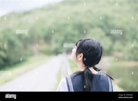 Portrait Of Asian Japanese School Girl Costume Looking At Park Outdoor