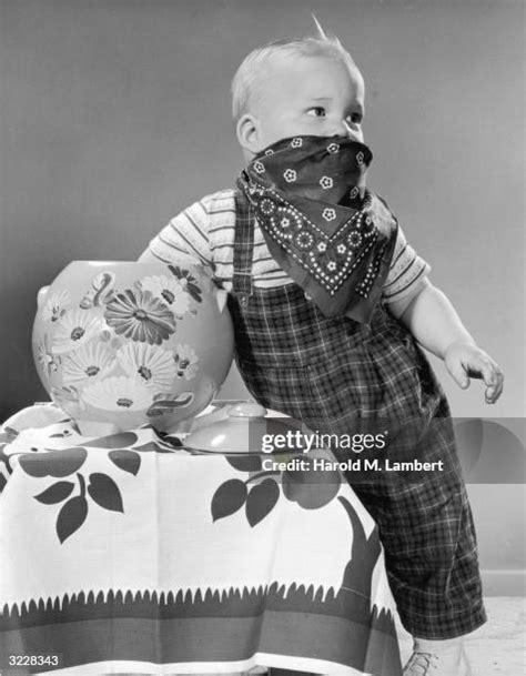 Bandana Over Mouth Photos And Premium High Res Pictures Getty Images
