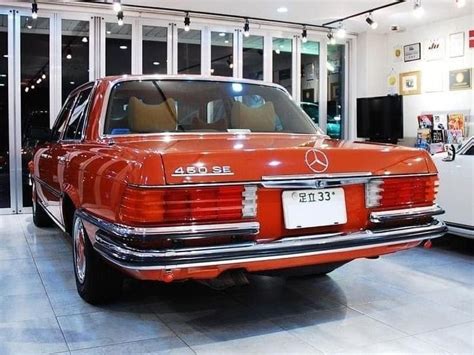 Orange Mercedes Benz Parked in Showroom
