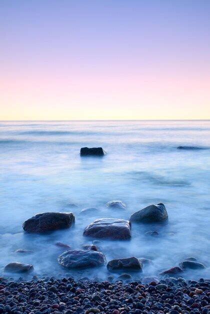 Premium Photo Romantic Morning At Sea Big Boulder In Smooth Wavy Sea