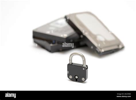 Computer Hard Disks And Metal Padlock Symbolizing Concept For Encrypted Data Cyber Security On