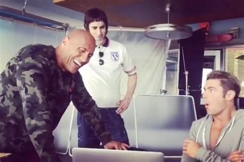 Watch Sacha Baron Cohen Shock Dwayne Johnson And Zac Efron With Graphic