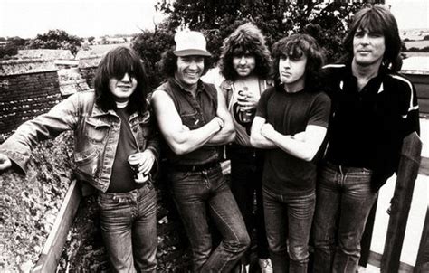 AC DC Four Decades Of Big Riffs And Babebabe Uniforms