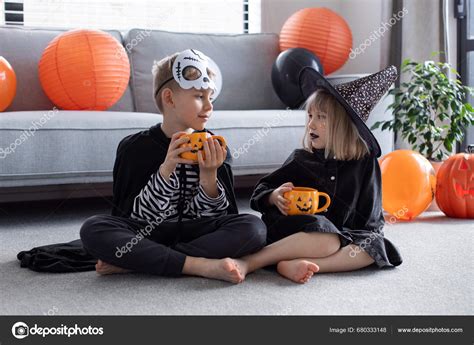 Cute Brother Sister Carnival Costumes Sitting Floor Having Fun