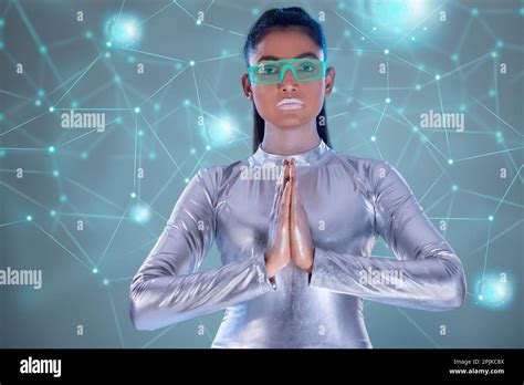 A Model Dressed As A Robot Wearing Silver Clothes And Digital Glasses